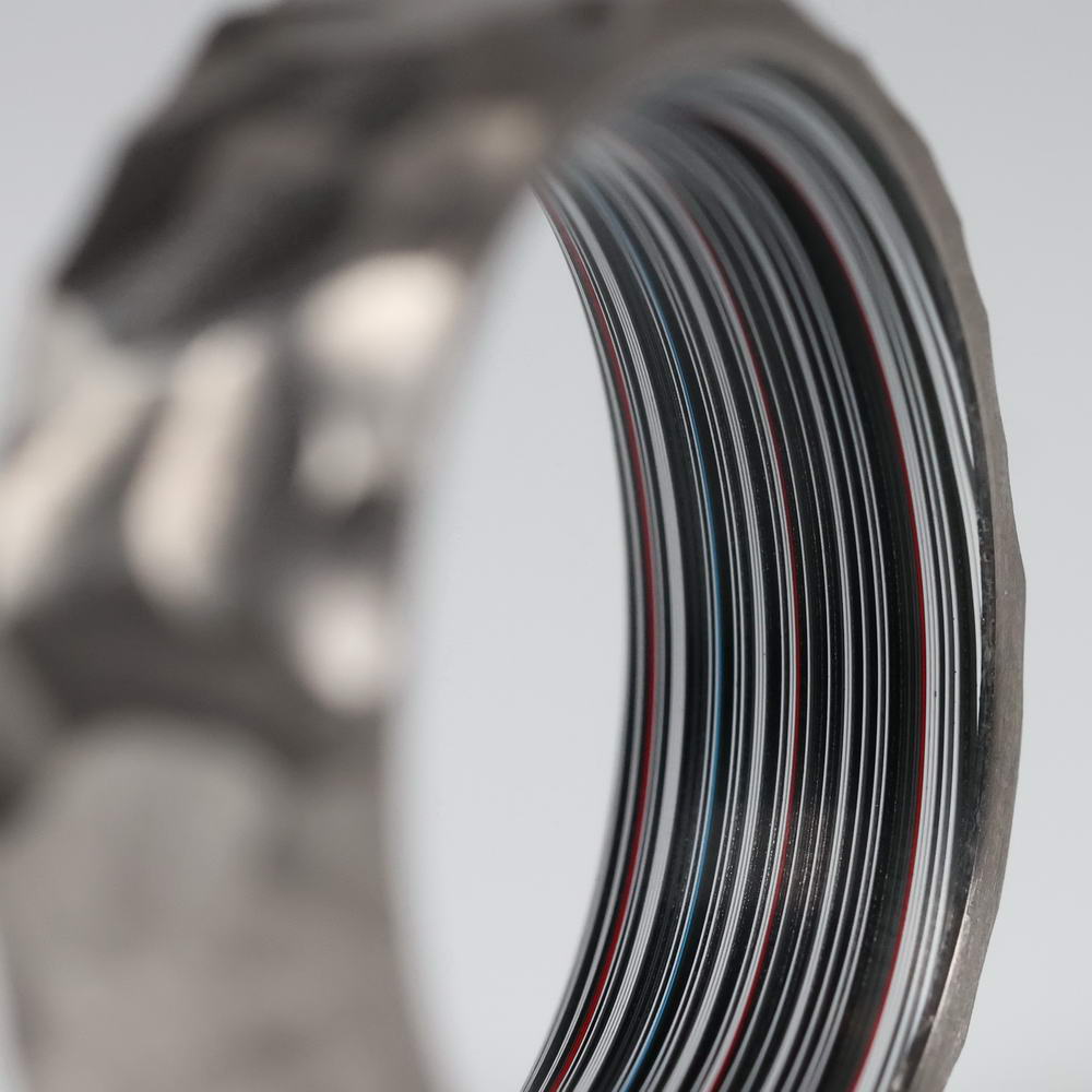Fordite Ring with Hammered Titanium Exterior | Element Ring Co